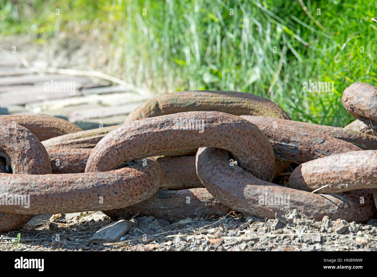 Rusty iron chain to make a connection Stock Photo - Alamy