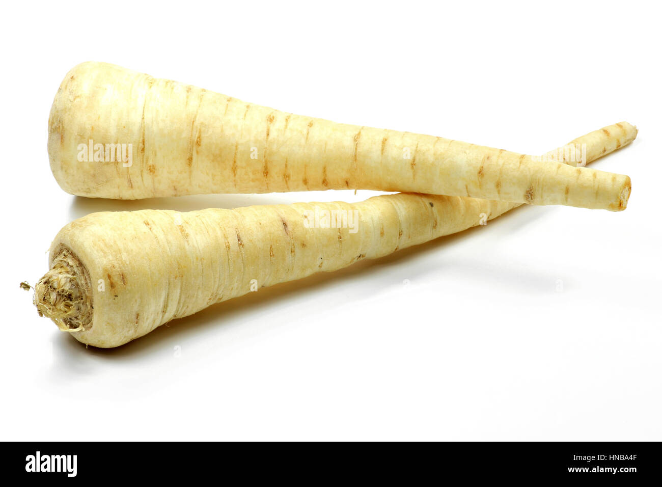 parsley roots isolated on white background Stock Photo - Alamy