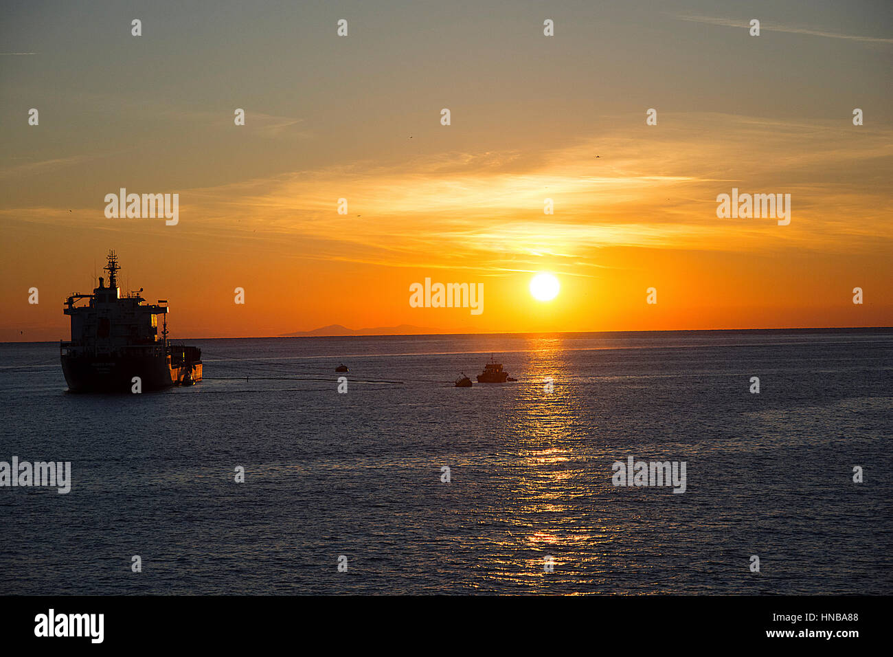 Watch the ships at sunset Stock Photo - Alamy