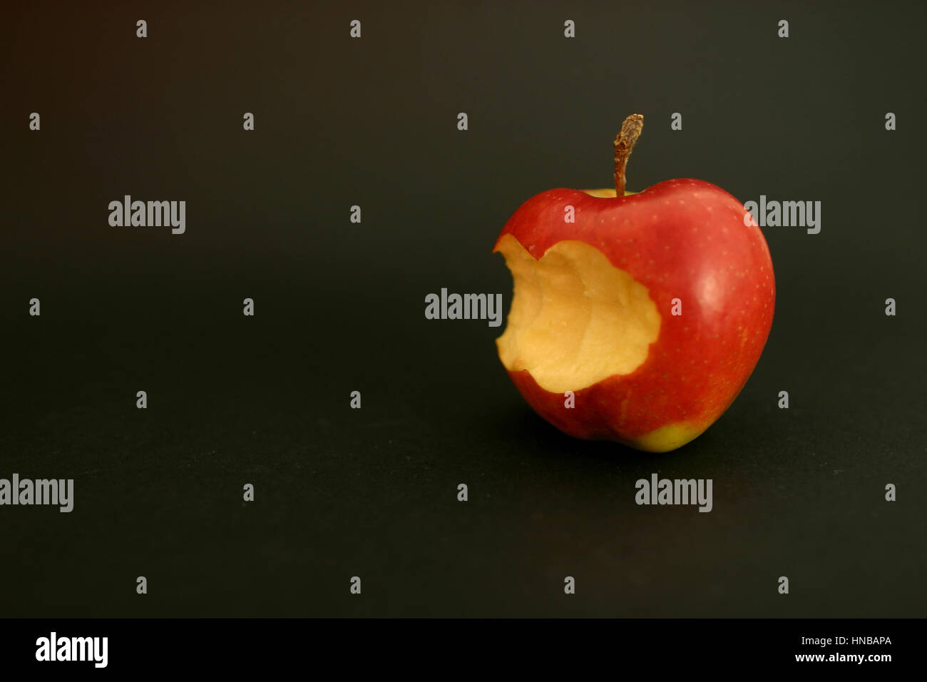 Apple with a bite Stock Photo - Alamy