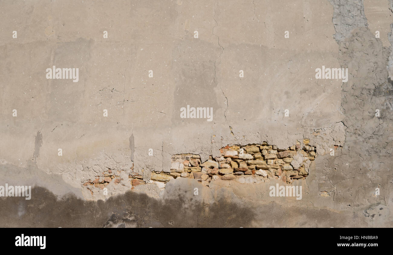 old wall made of limestone bricks with scratches and cracks Stock Photo ...