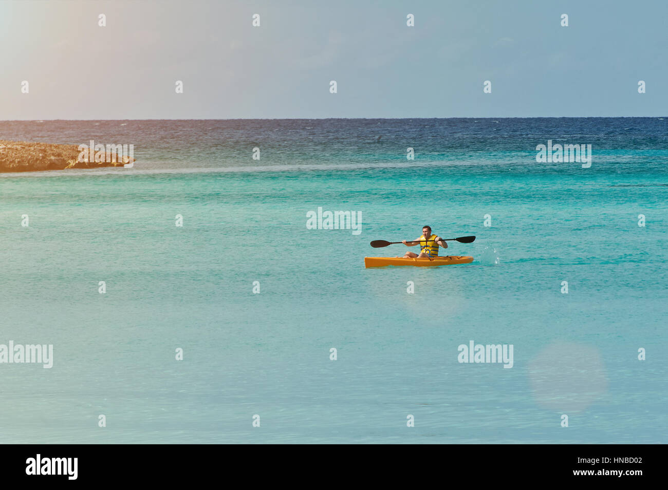 one man in kayak at caribbean blue sea Stock Photo - Alamy