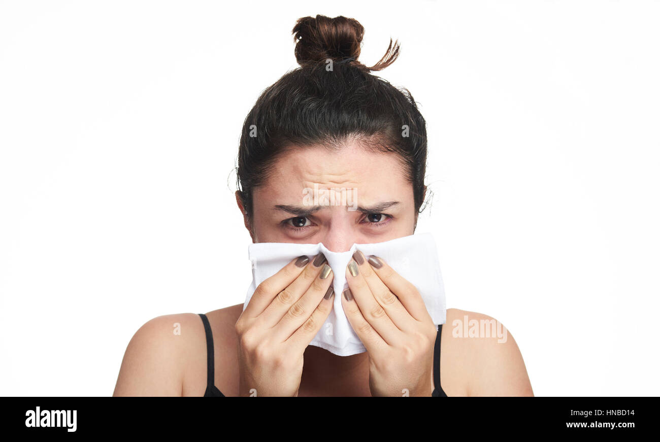 girl blowing her nose in tissue isolated on white Stock Photo - Alamy