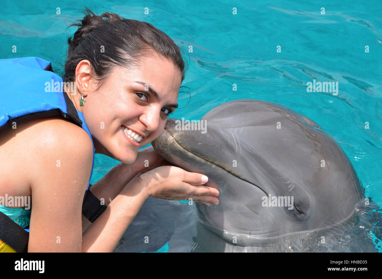 Woman swimming with dolphin hi-res stock photography and images - Alamy
