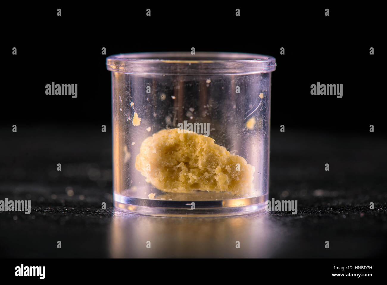 Macro detail of a single piece of marijuana extraction concentrate aka ...