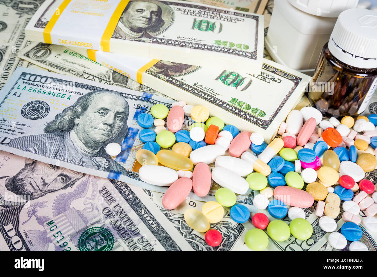 drugs on a money background. Money and pills Stock Photo - Alamy