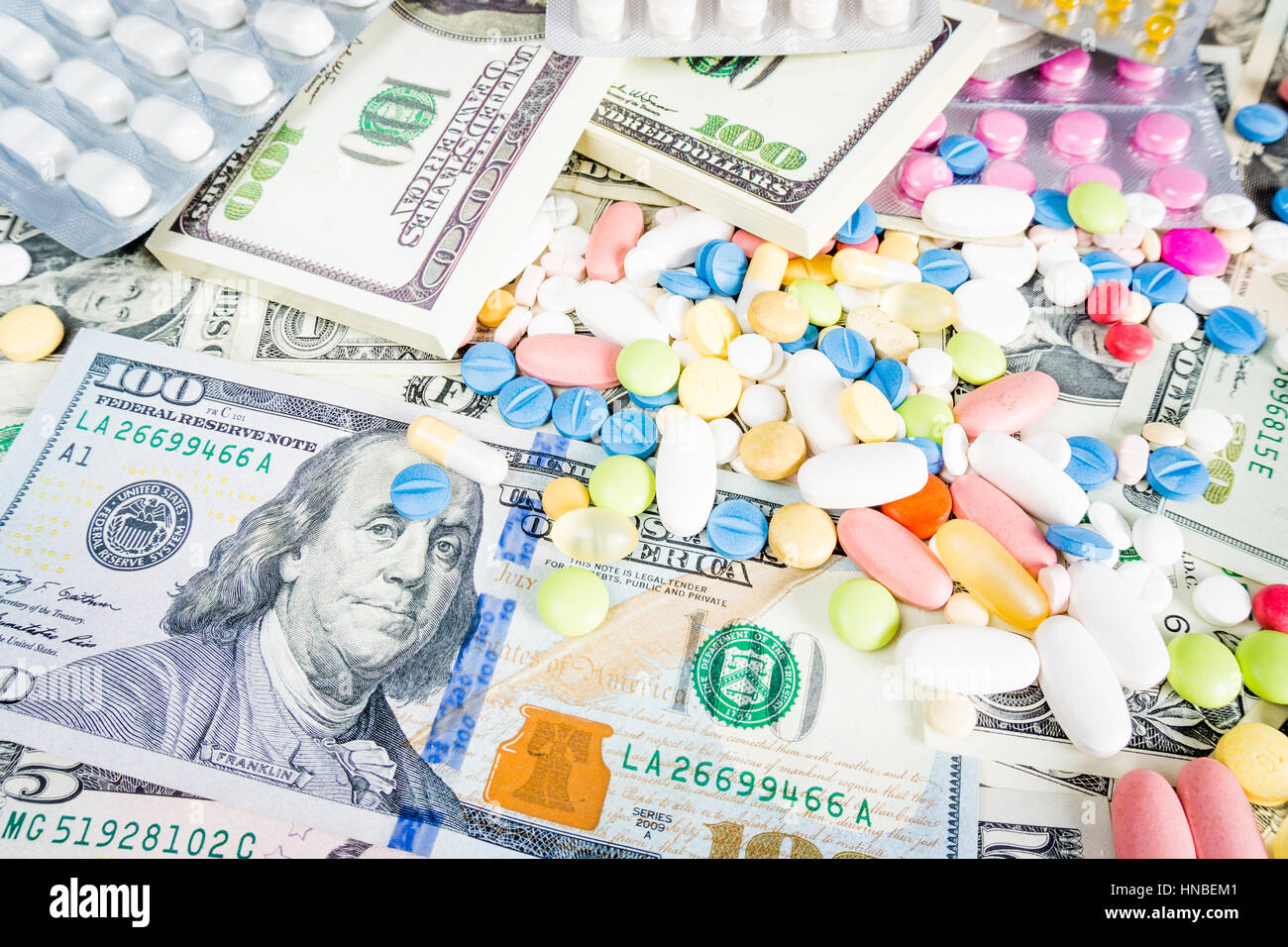 Money and pills. Pills of different colors on money. medicine concept ...