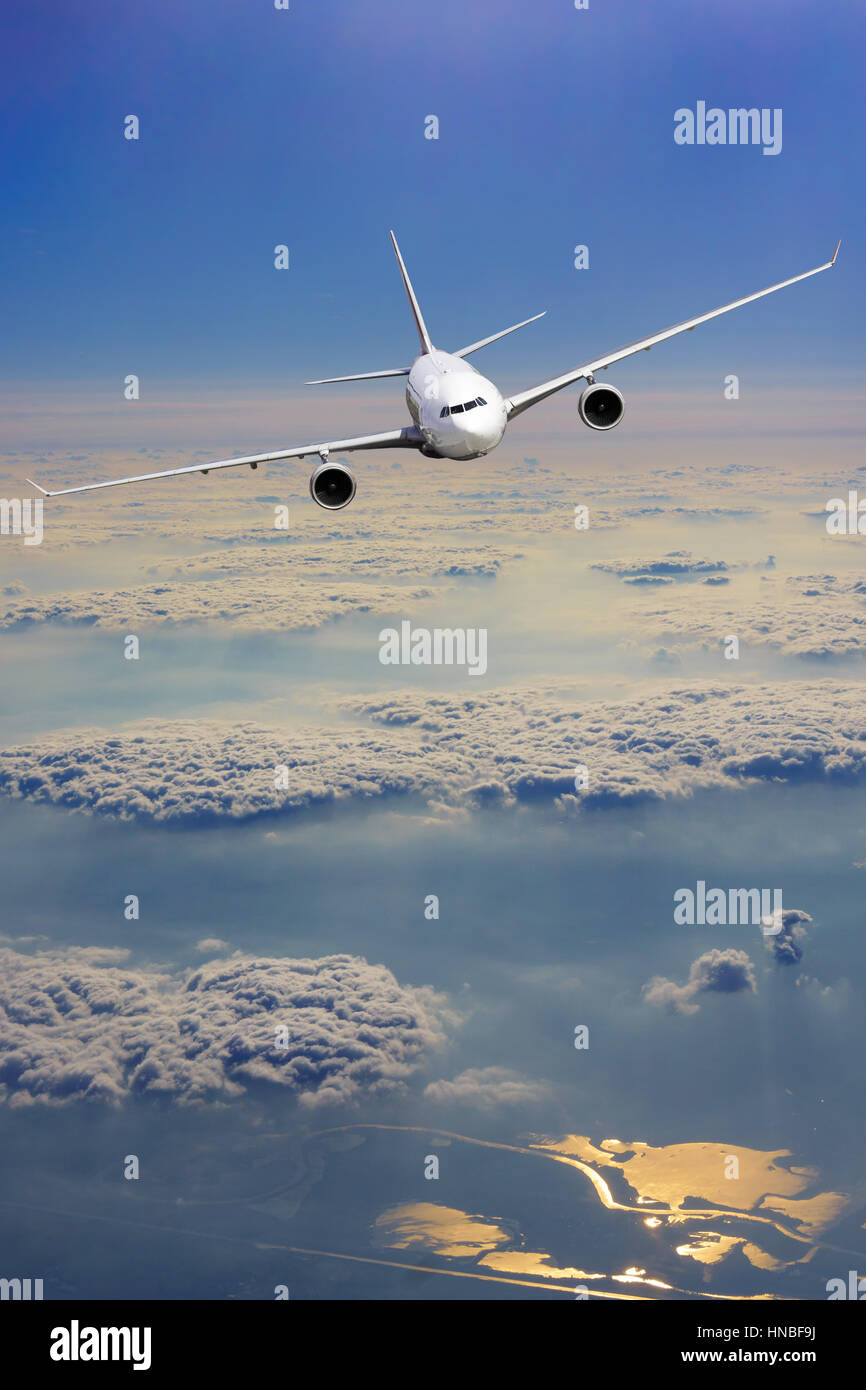 Airplane fly over clouds. Transportation travel concept Stock Photo - Alamy