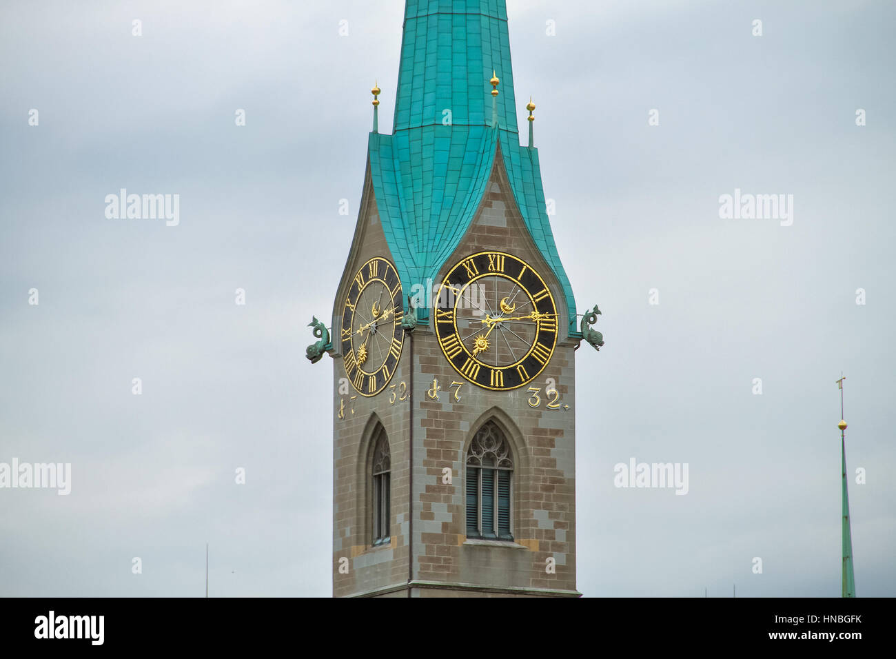 The tower with old clock which towers over the city Stock Photo - Alamy