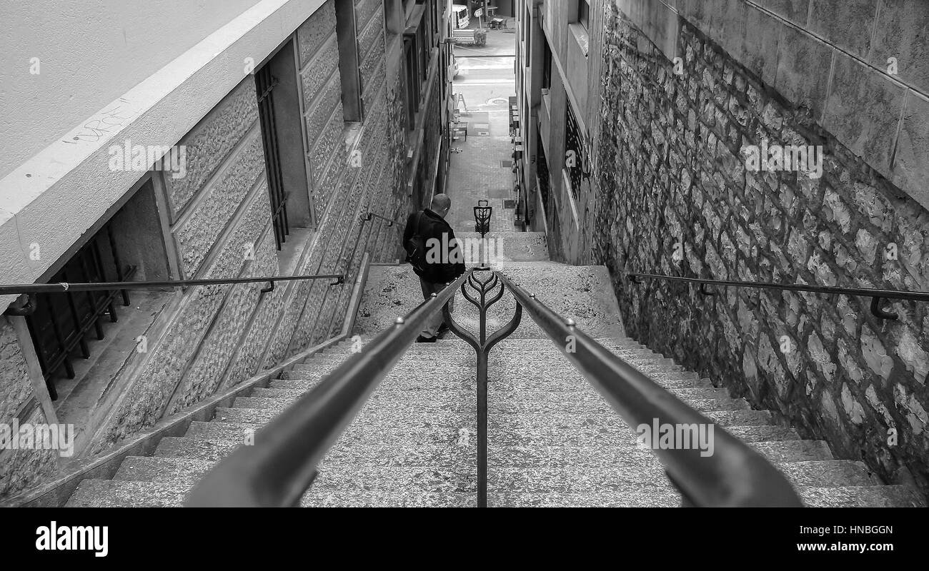 The steps leading down between the houses Stock Photo - Alamy