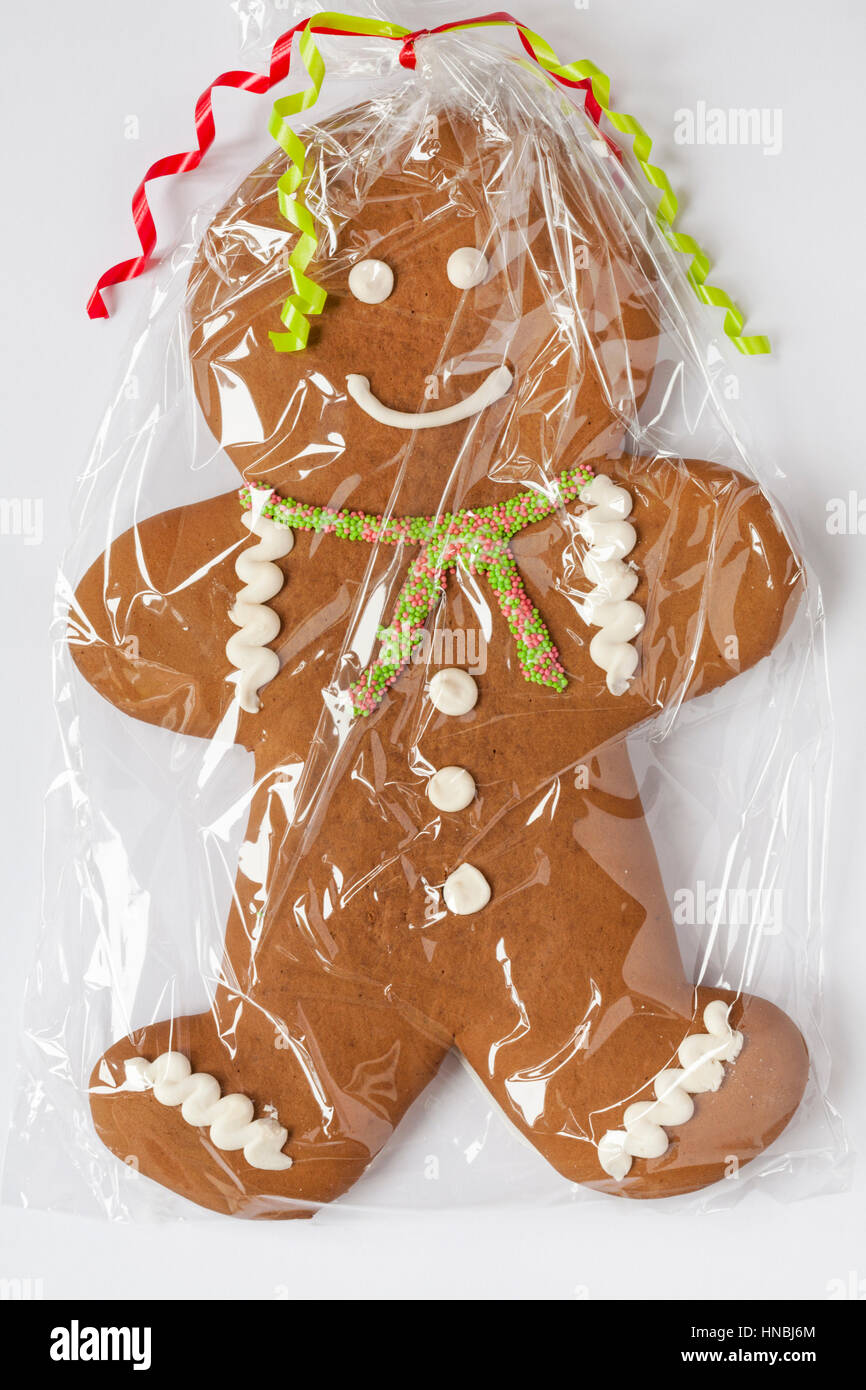 Large Gingerbread man biscuit wrapped in cellophane isolated on white ...