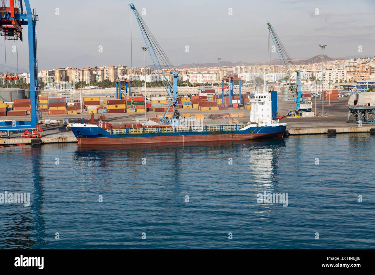 Massive freighter at an industrial dock in Malaga Spain Stock Photo - Alamy