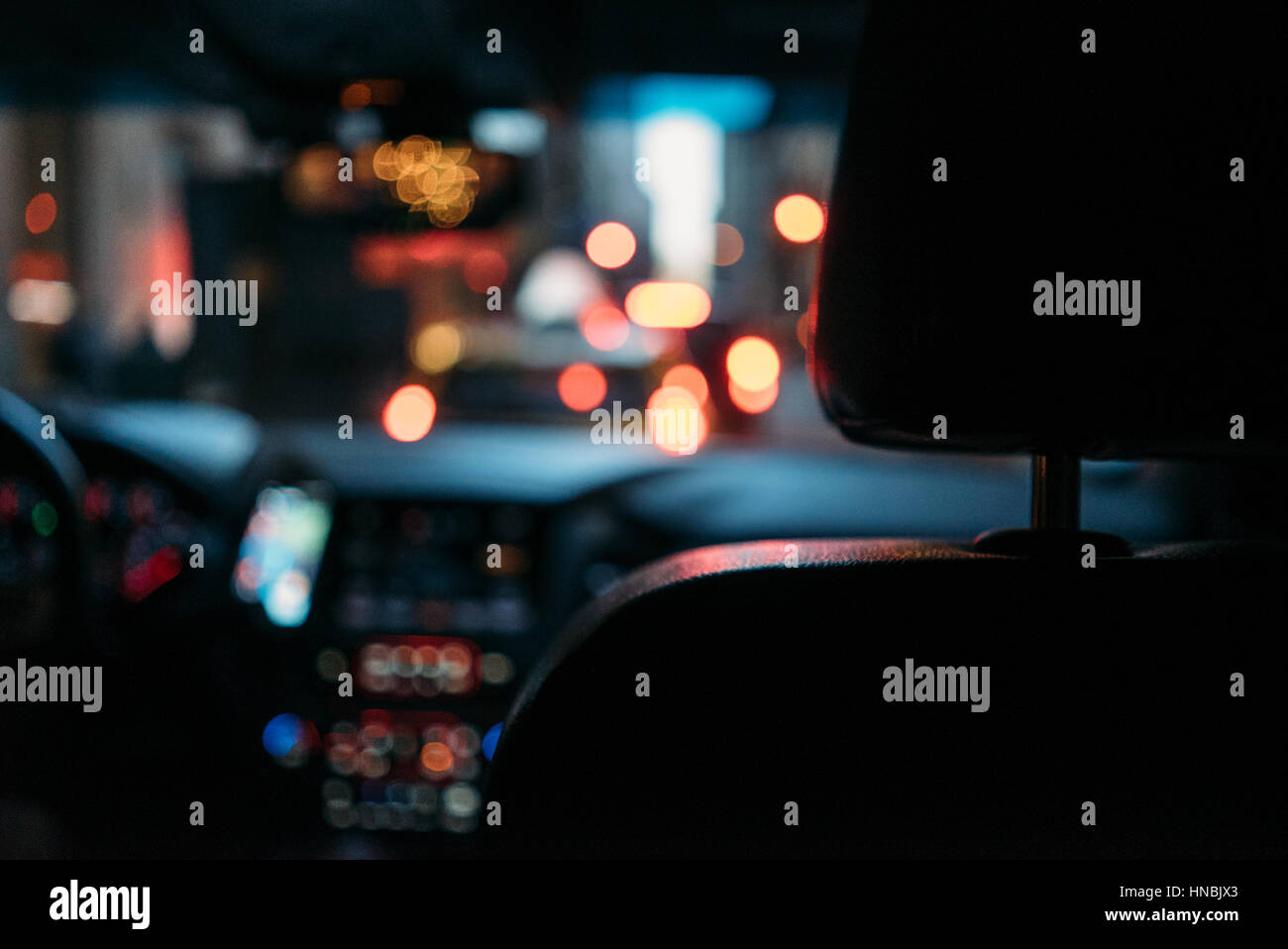 Night road view from inside car with natural light street and other ...