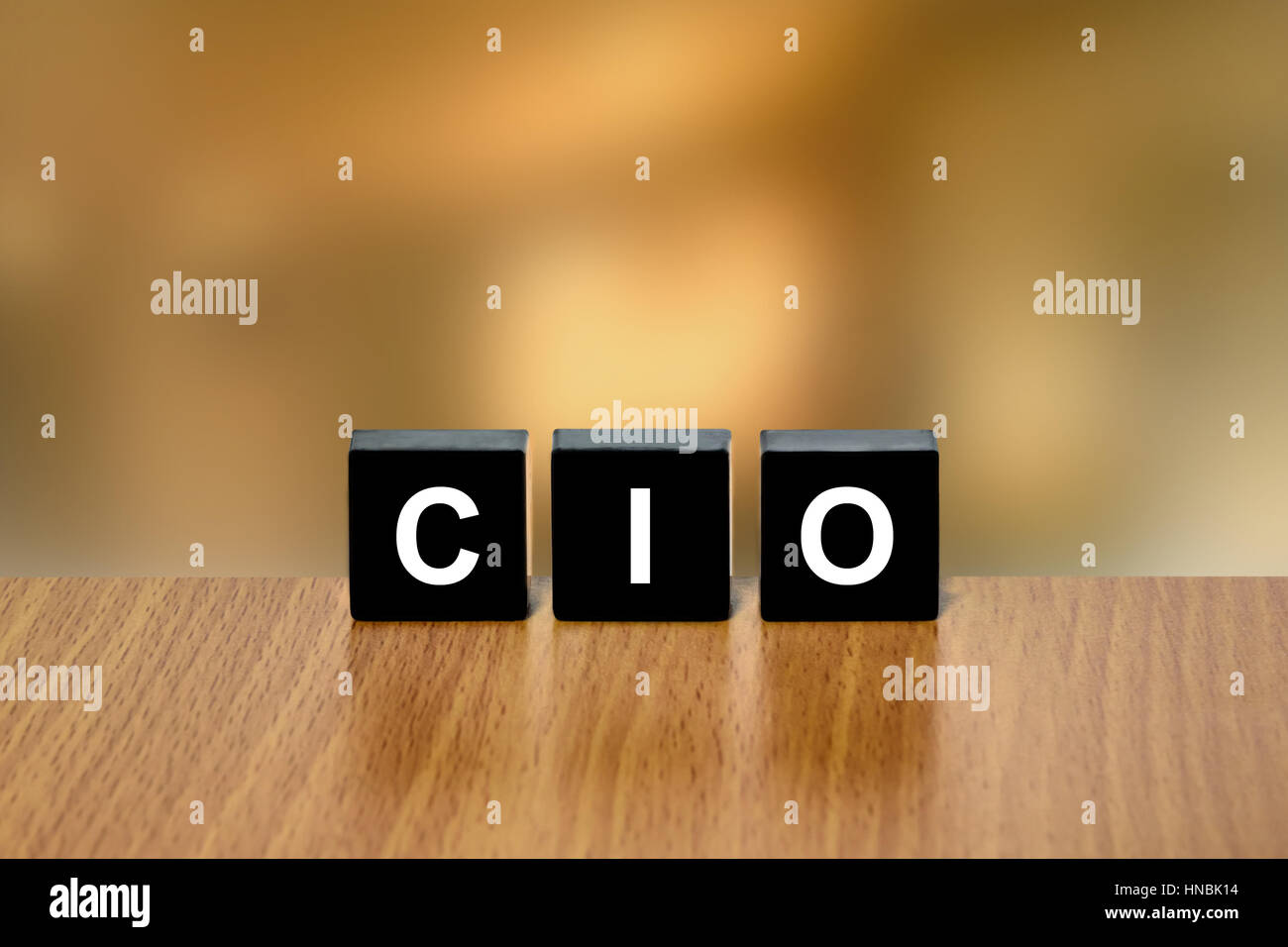 CIO or Chief investment officer on black block with blurred background ...
