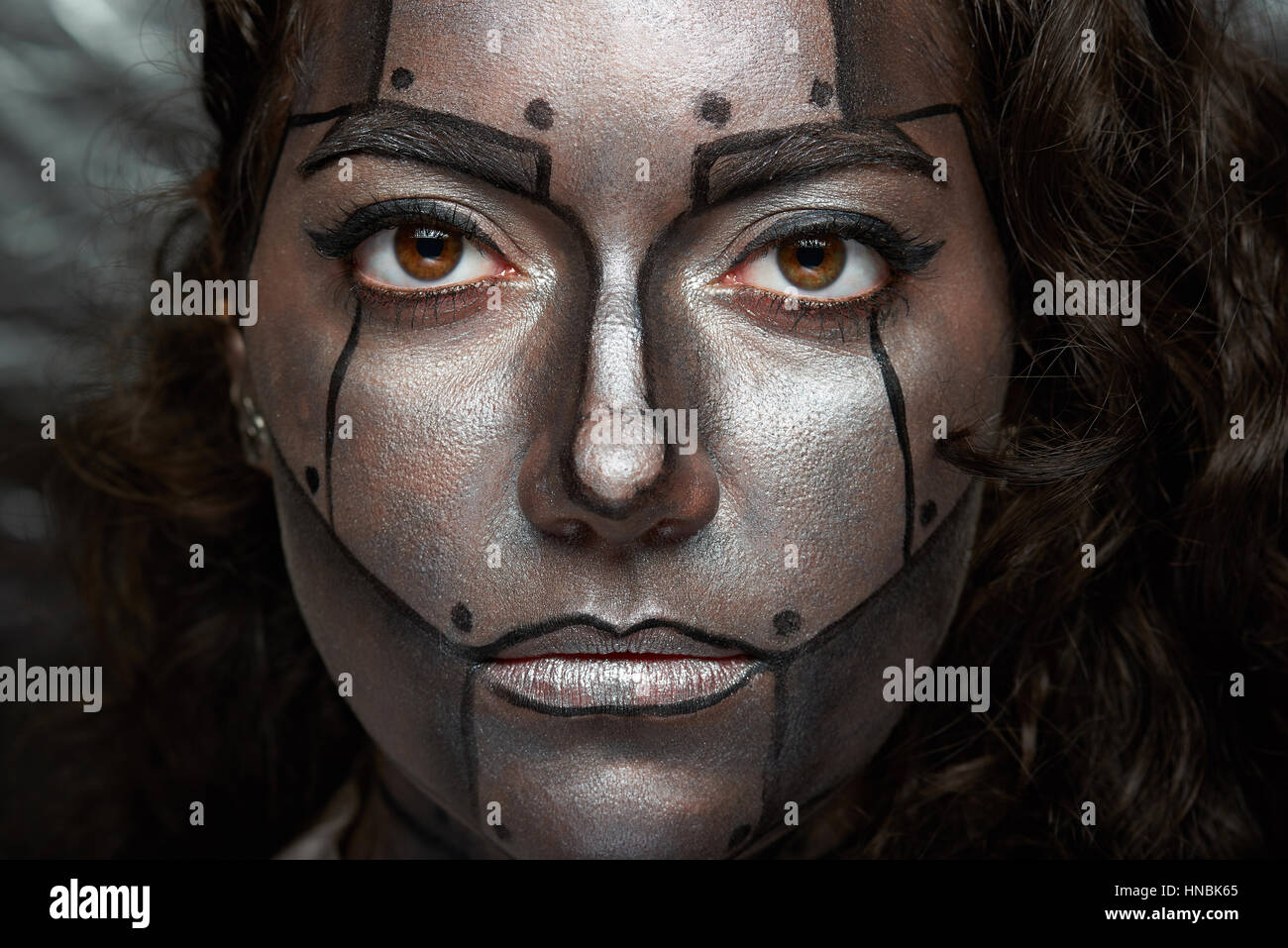 close up silver women face painted of robot style Stock Photo - Alamy