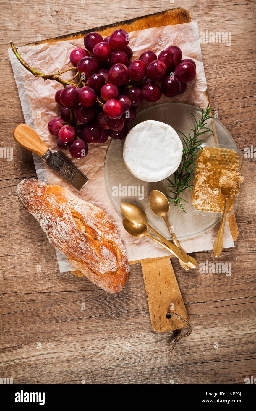 Breakfast with Camembert cheese, grapes and honey. French healthy food ...