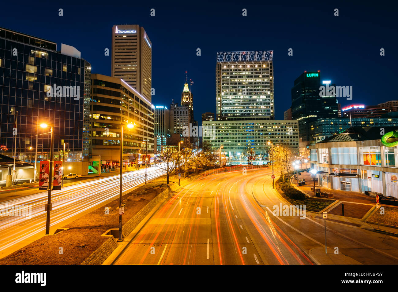 Light Street and the skyline of downtown at night, in Baltimore ...