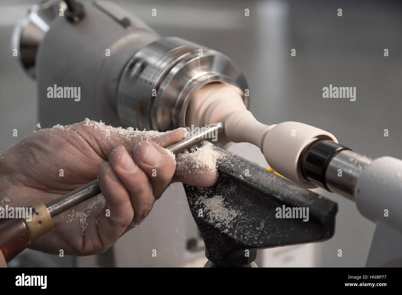 Wood manufacturing on a turning lathe Stock Photo - Alamy