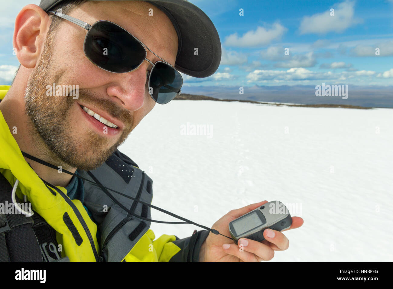 Man finding the way with GPS device Stock Photo - Alamy