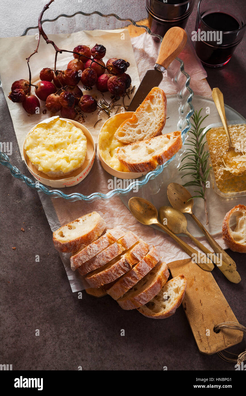 Breakfast with Camembert cheese, grapes and honey. French healthy food ...