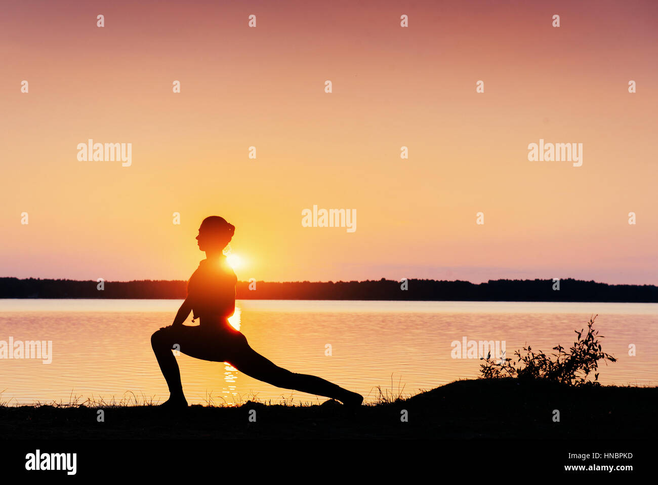 girl at sunset by the lake Stock Photo - Alamy