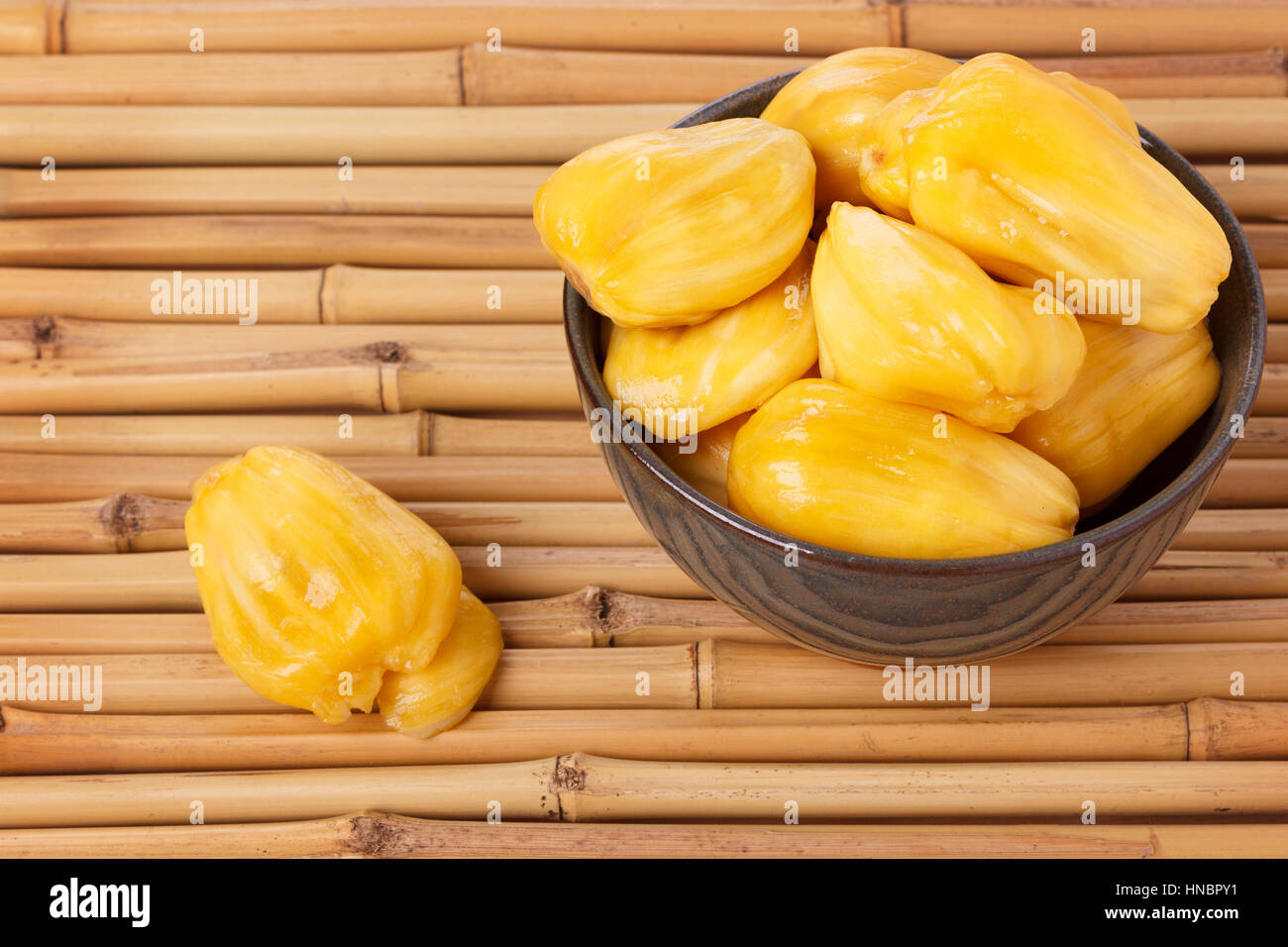 Tropical fruit Jackfruit (jakfruit, jack, jak) in bowl on bamboo ...