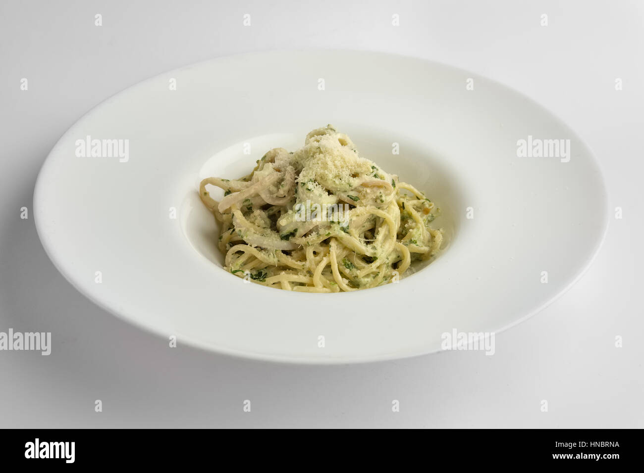 Big white plate with spaghetti with cheese Stock Photo - Alamy