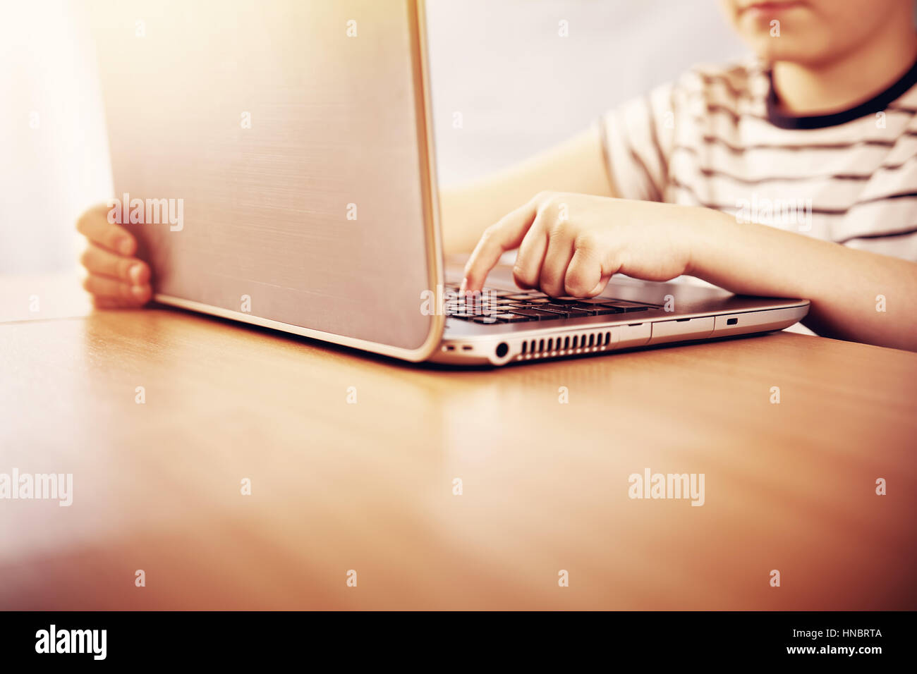 seven years old child sitting with a laptop Stock Photo - Alamy