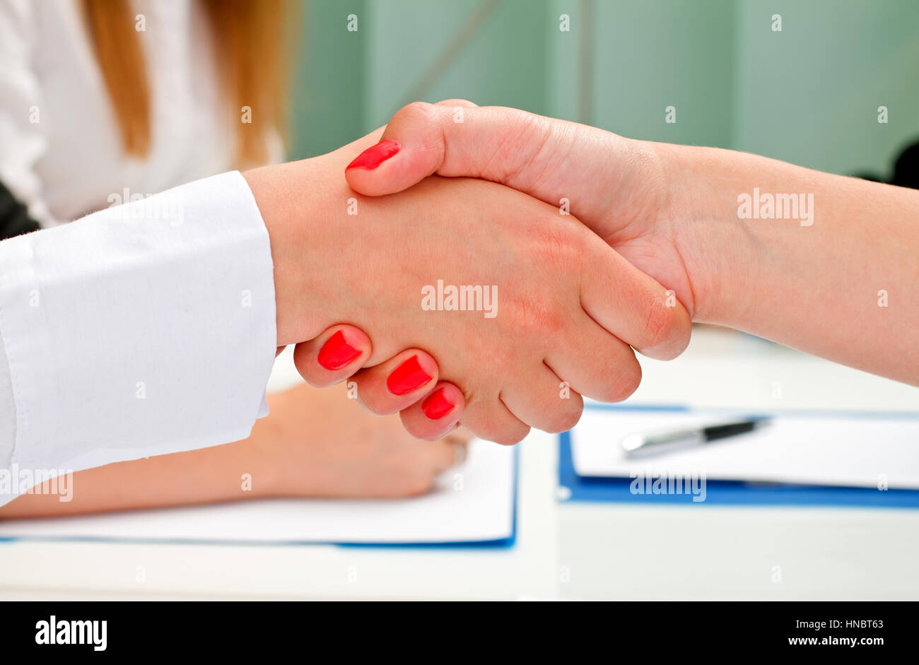 A confident handshake after a successful business Stock Photo - Alamy