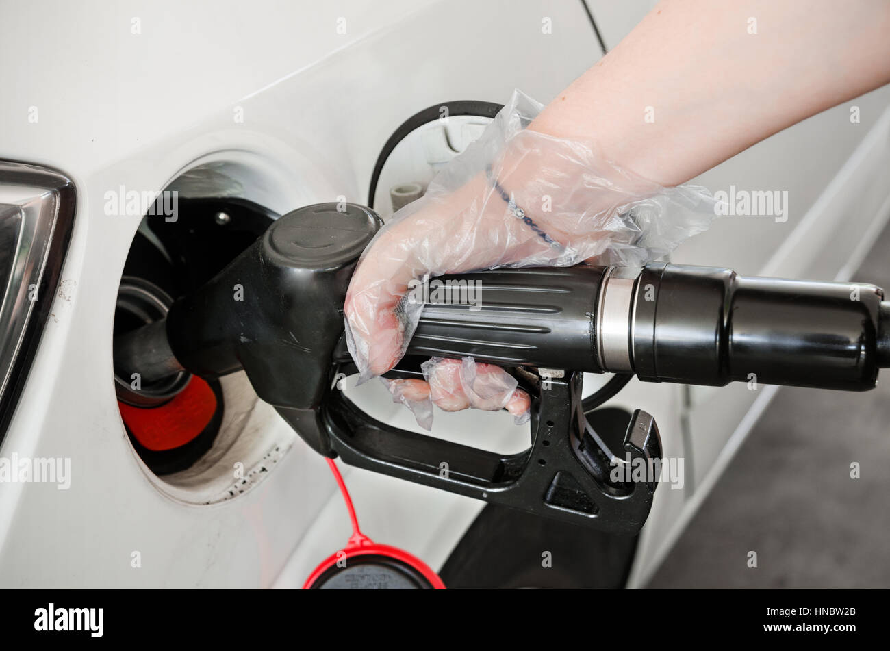 Woman filling up car fuel hi-res stock photography and images - Alamy