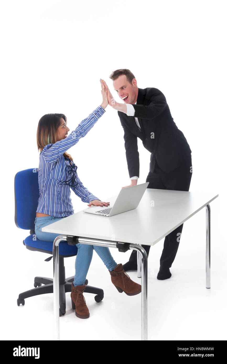 secretary with laptop at table and boss seem happy with result and give ...
