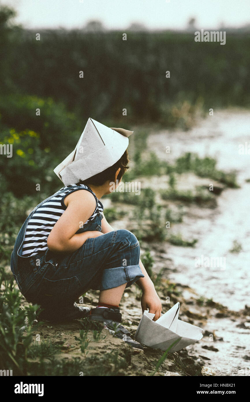 Boys with toy boat hi-res stock photography and images - Alamy