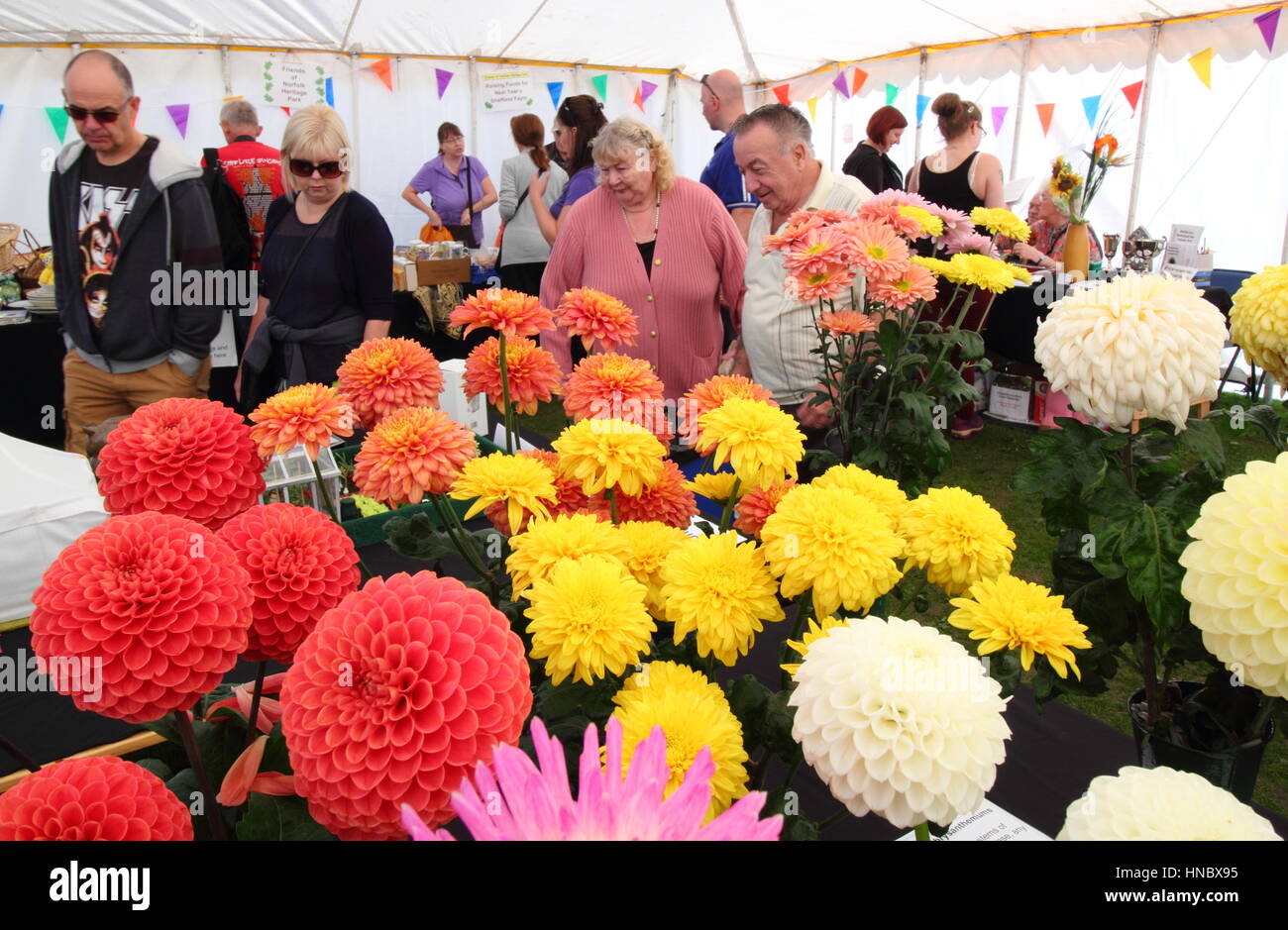 Visitors admire flower, vegetable and fruit displays at a traditional ...