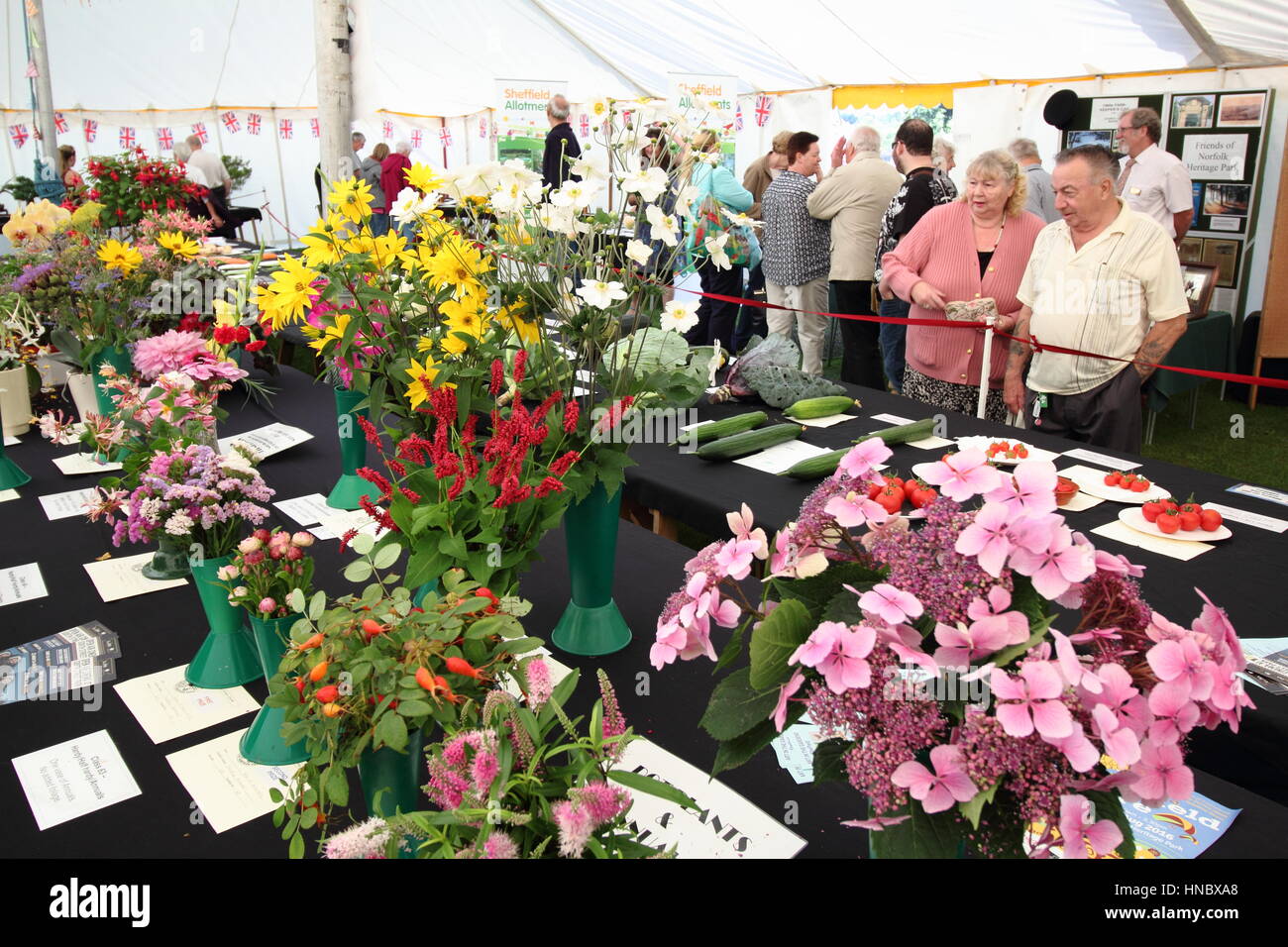 Visitors admire flower, vegetable and fruit displays at a traditional ...
