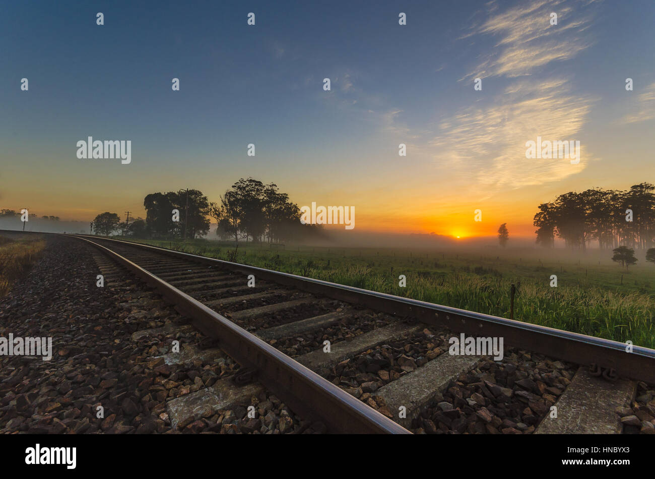 Sunrise over train tracks hi-res stock photography and images - Alamy