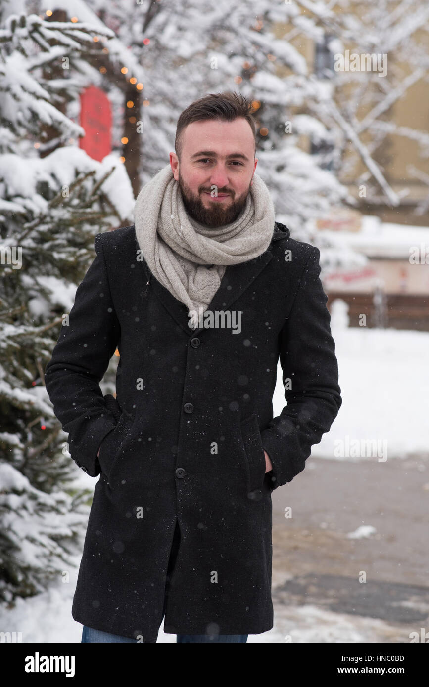 Portrait of a man standing in the snow Stock Photo - Alamy