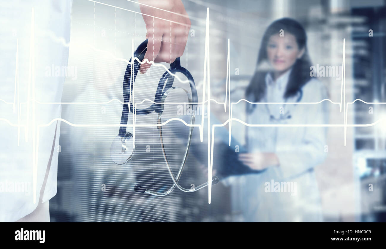 Exposure image of doctor hand with stethoscope and media concept. Mixed ...