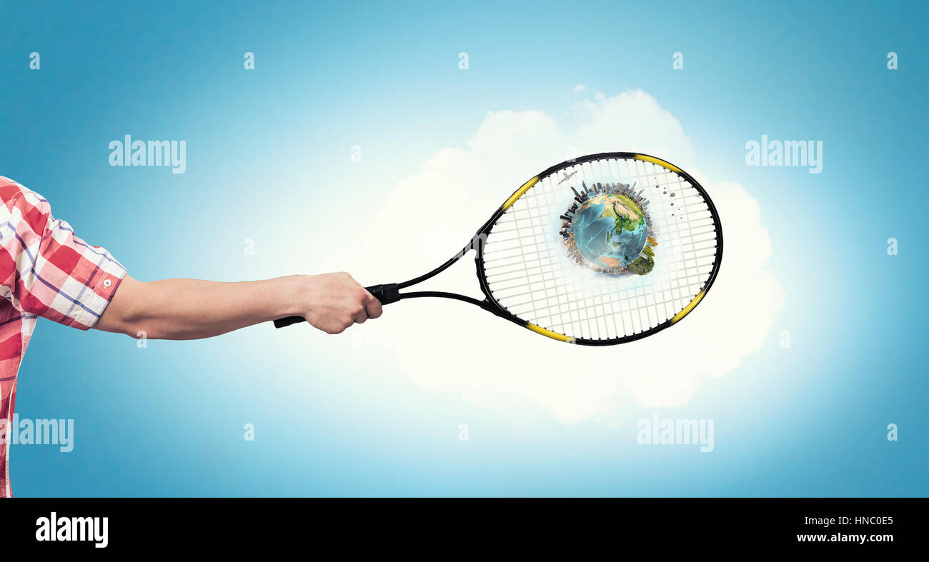 Close up on hand with big tennis racket. Elements of this image are ...