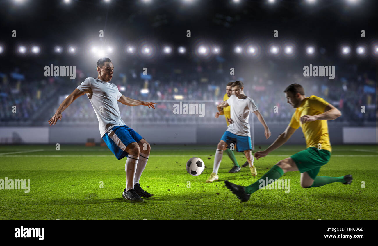 Soccer players in action on stadium fighting for ball. Mixed media ...