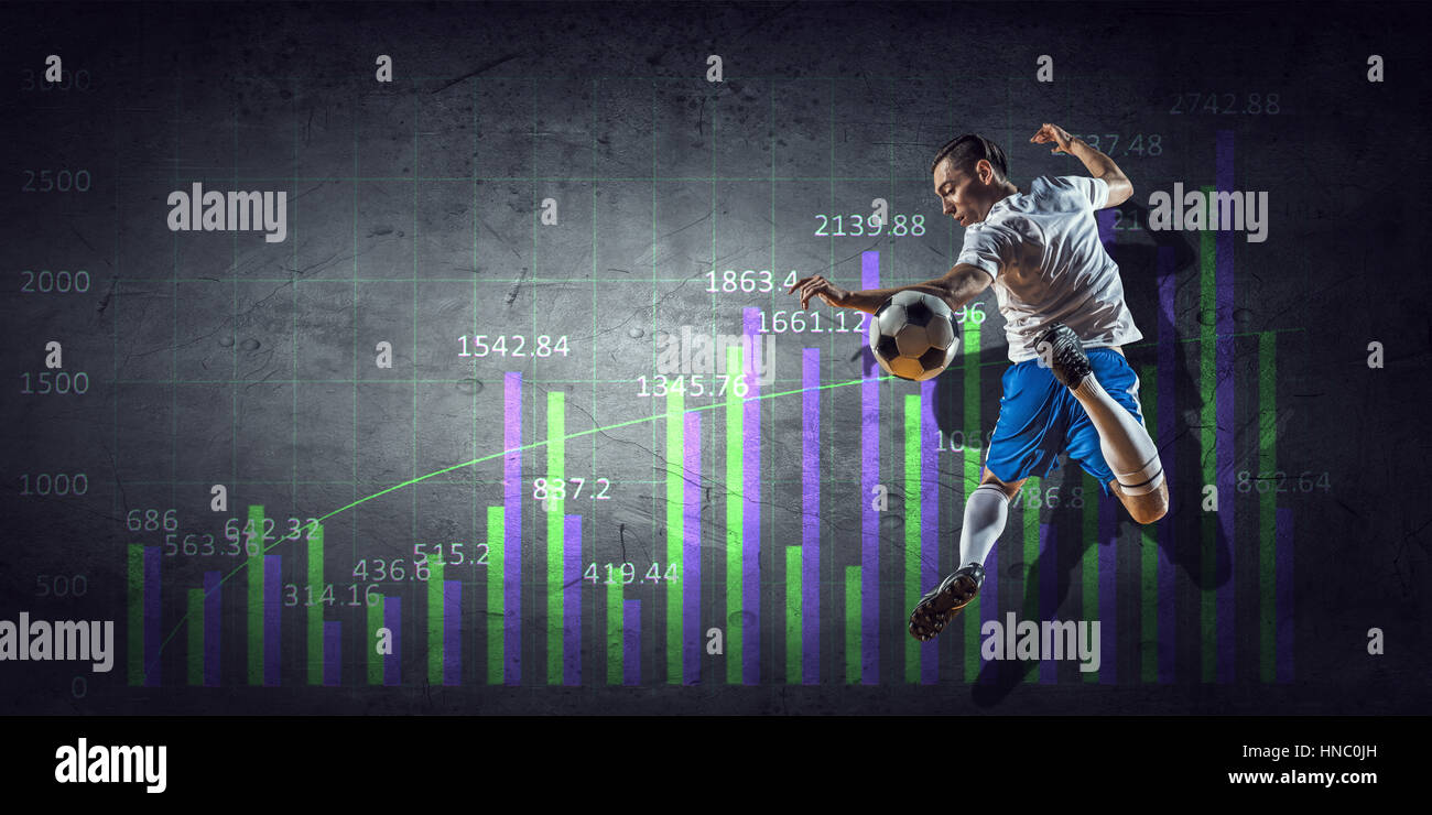 Football player kicking ball and graphs at background. Mixed media ...
