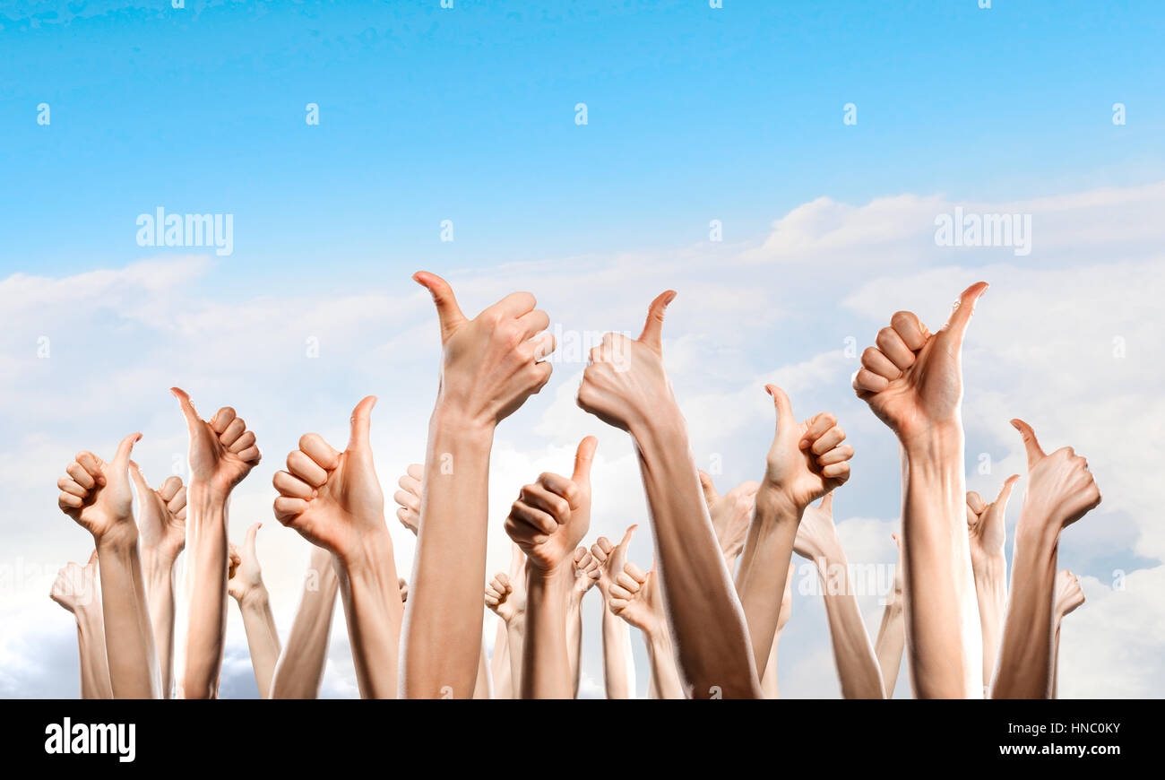 Row of raised hands showing different gestures Stock Photo - Alamy