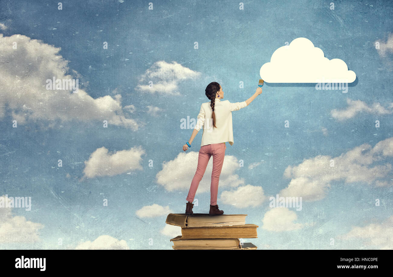 Young woman drawing happiness and positivity concept on wall Stock ...