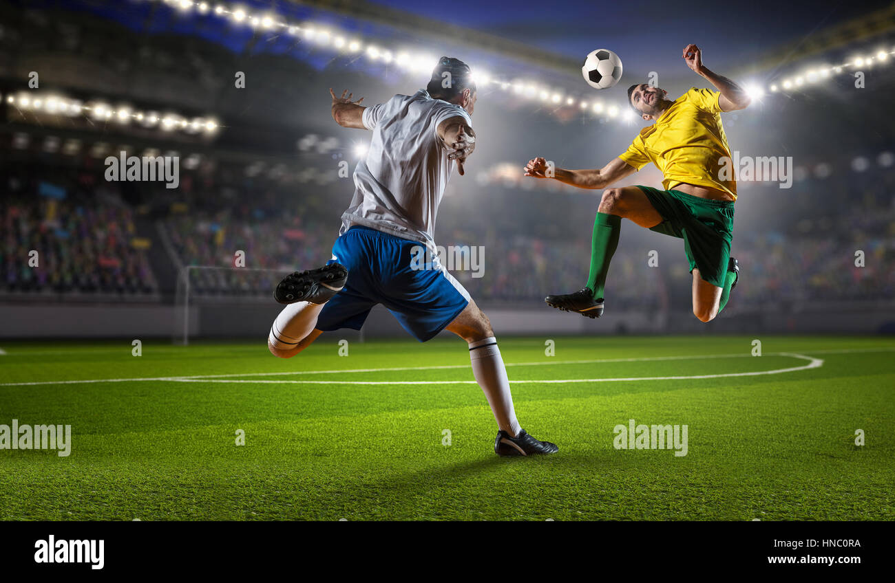 Soccer players in action on stadium fighting for ball. Mixed media ...