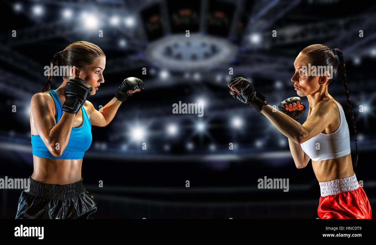 Two young pretty women boxing in ring. Mixed media Stock Photo - Alamy
