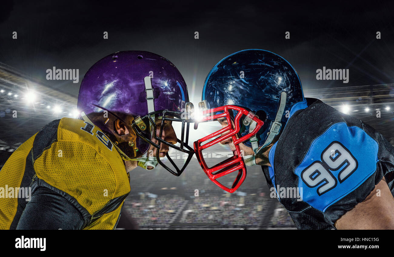 Two american football players fighting for ball. Mixed media Stock ...