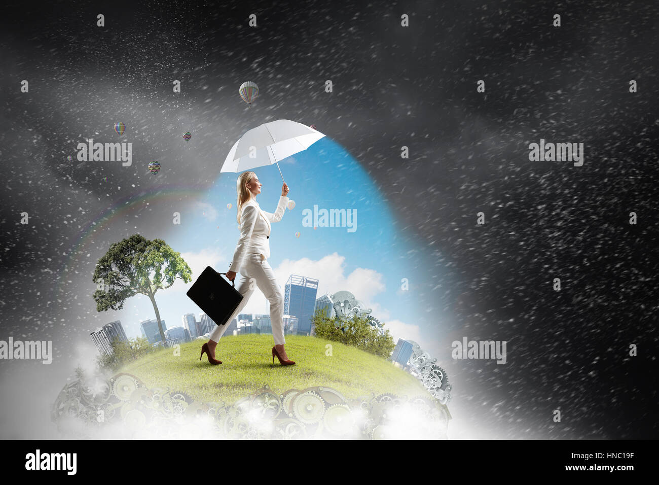 Elegant businesswoman hiding from rain under umbrella Stock Photo - Alamy