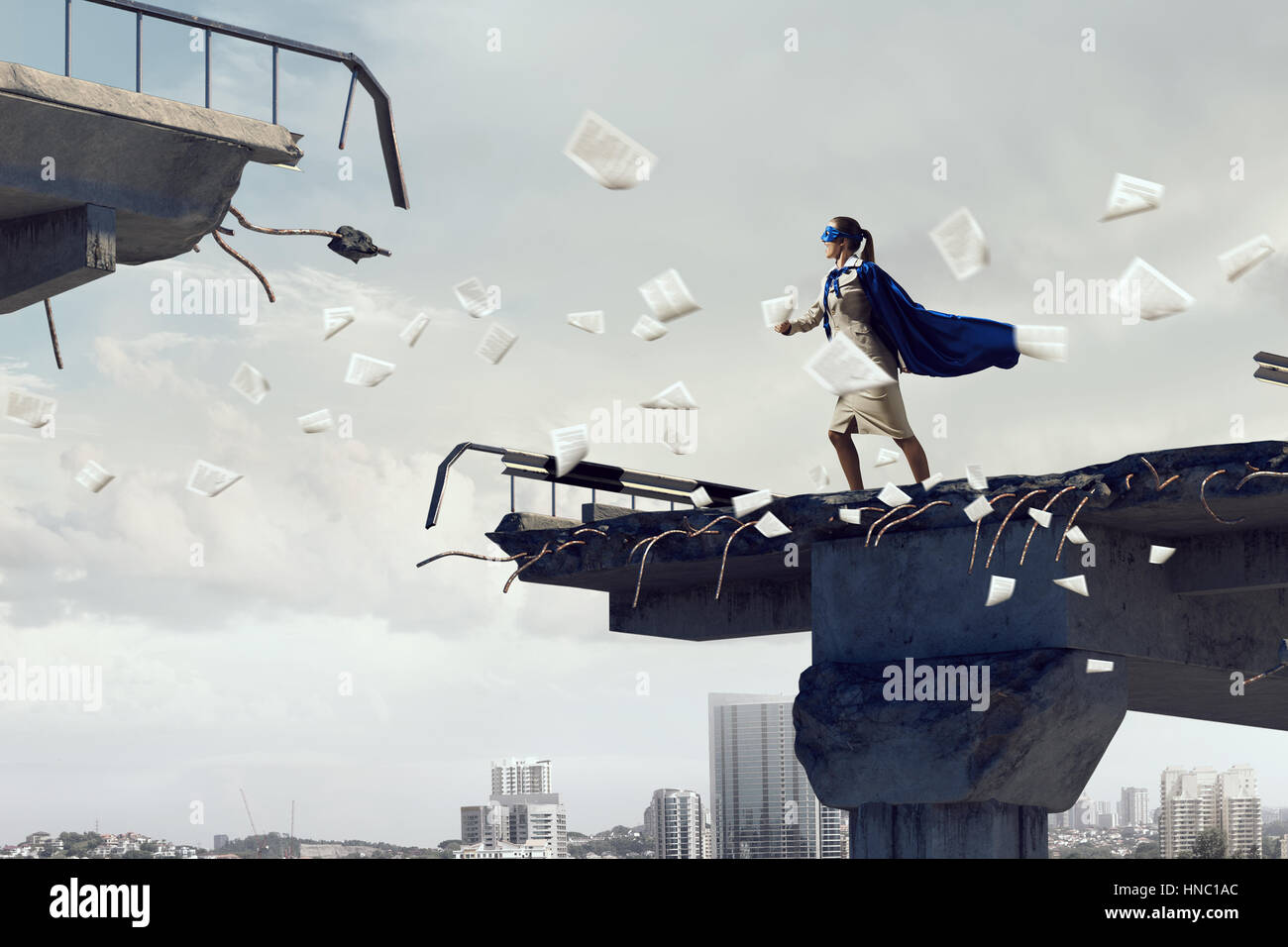 Young busineswoman in mask and cape standing on destroyed bridge Stock ...