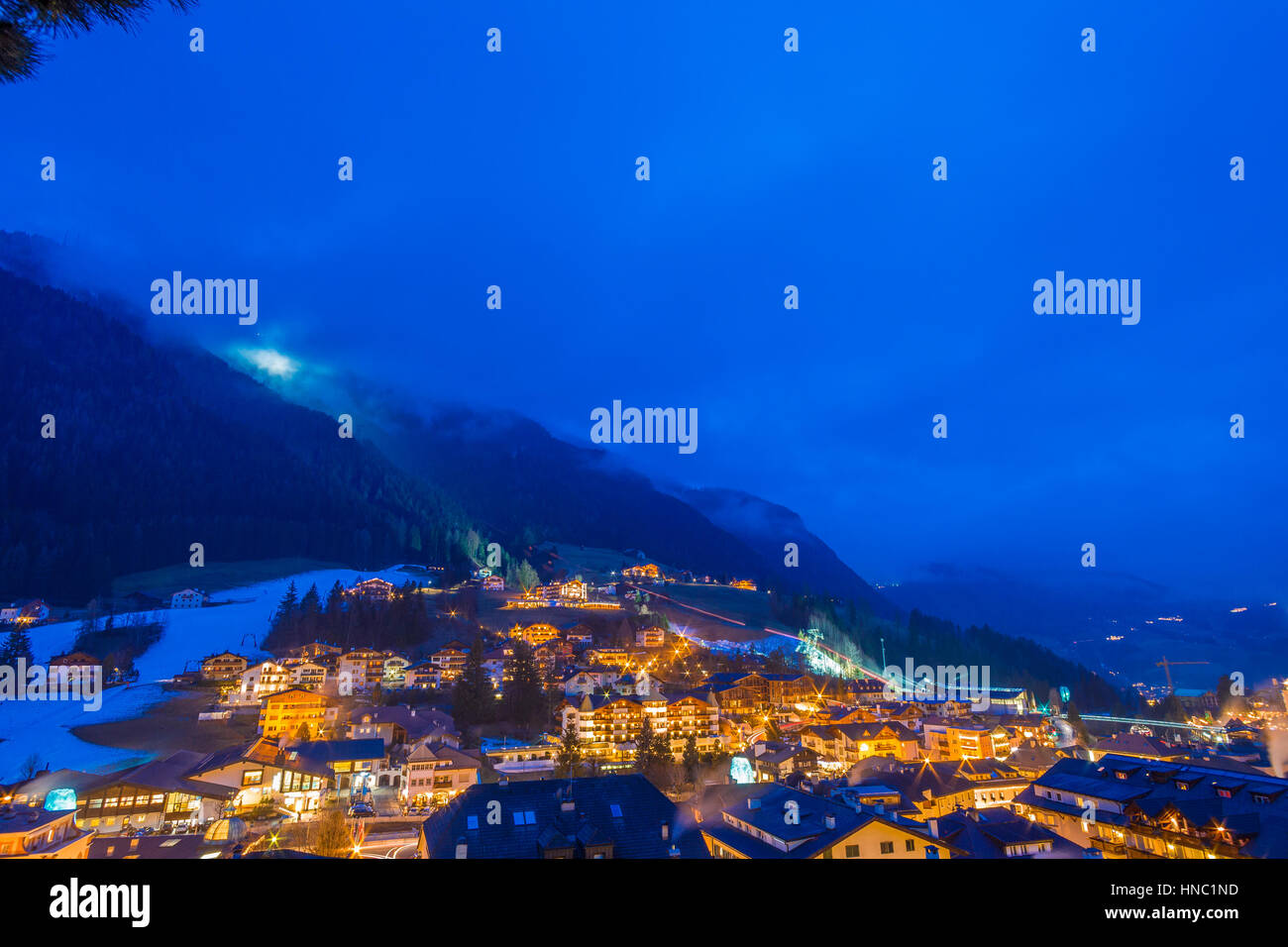 night view of typical mountain village in alpine valley in Italy Stock ...