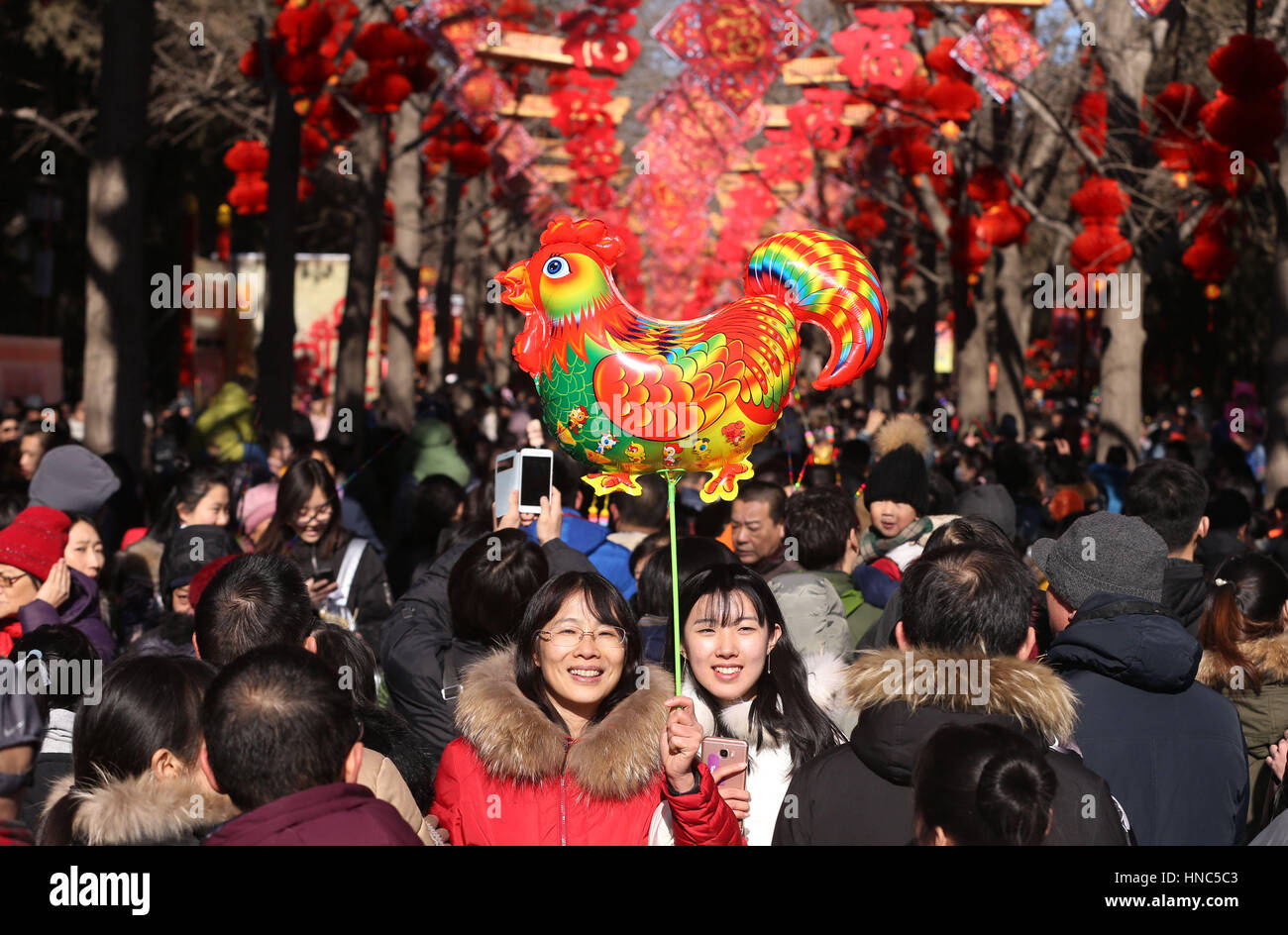 Beijing, China. 30th Jan, 2017. People visit a temple fair at Beijing ...