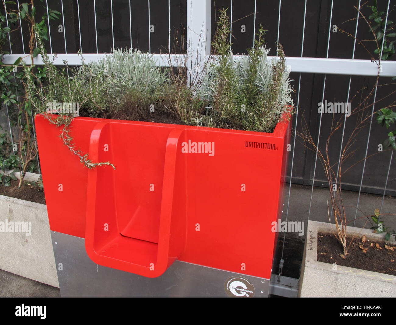 A flower pot in the shape of a pissoir can be seen at the Gare de Lyon ...